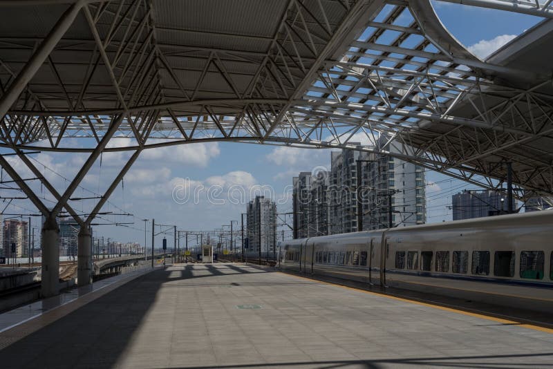 Empty Station with a Train Against the Background of the City Buildings ...