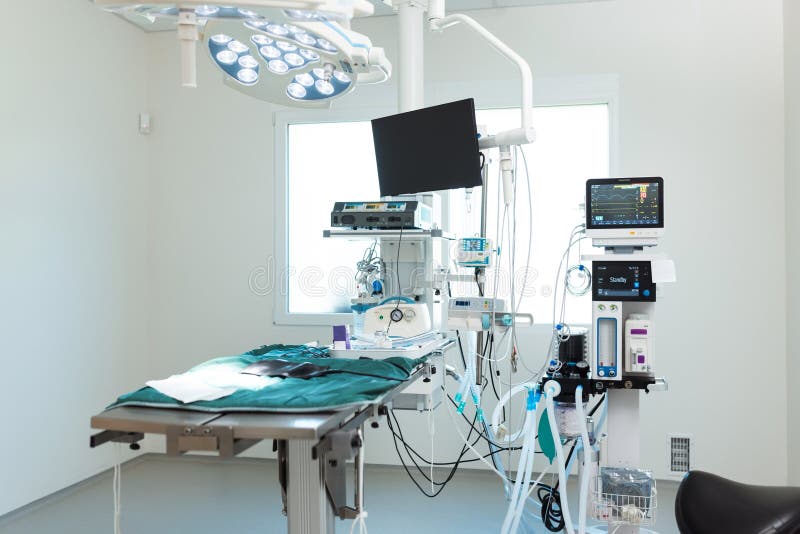 Sterile Operating Room with Surgical Table, Bright Overhead Lights ...
