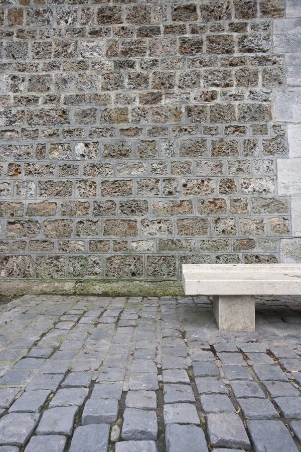 Empty Stone Bench Against a Brick Wall Stock Photo - Image of ...