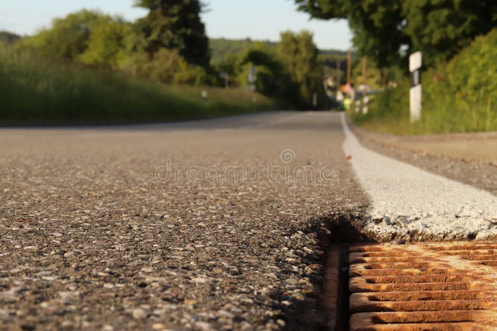 Empty Street with a Gully in the Front Stock Image - Image of green ...