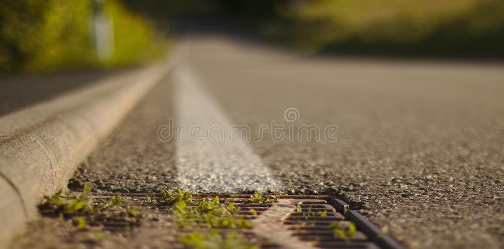 Empty Street with a Gully in the Front Stock Photo - Image of asphalt ...
