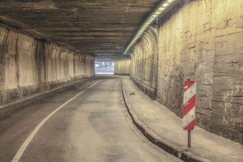 An Empty Street Surrounded by Concrete Walls in a Tunnel, Stock Photo ...