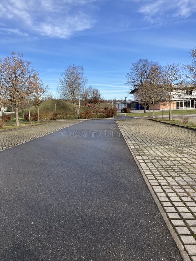 Empty Suburban Road Under a Blue Sky Stock Photo - Image of blue, view ...
