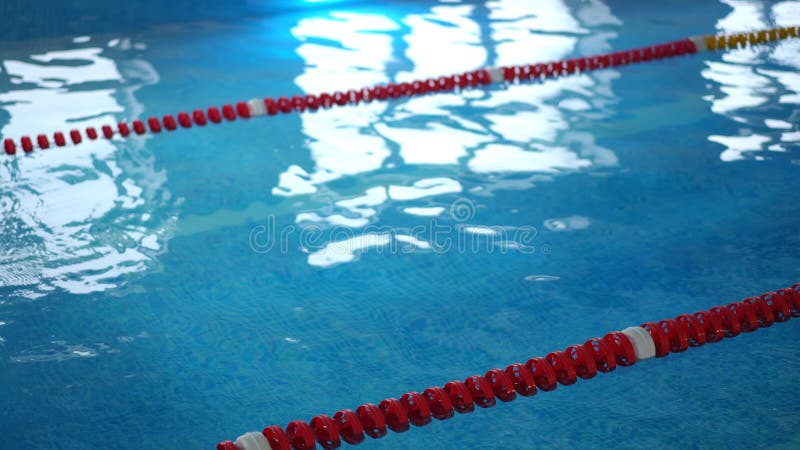 An Empty Swimming Pool with Many Lanes that is Separated by Red Pool ...