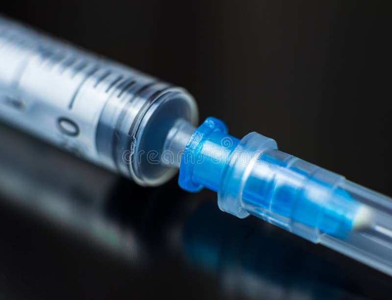 Empty Syringe Positioned on a Dark Surface Stock Image - Image of ...