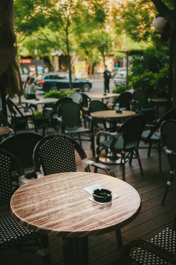 An Empty Table and Chairs in the Garden of the Restaurant during the ...