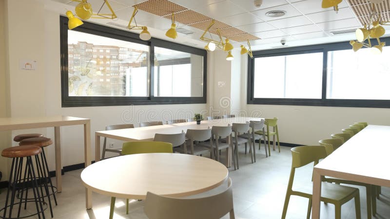 Interior of Office Cafeteria with Tables and Chairs with Glass Windows ...