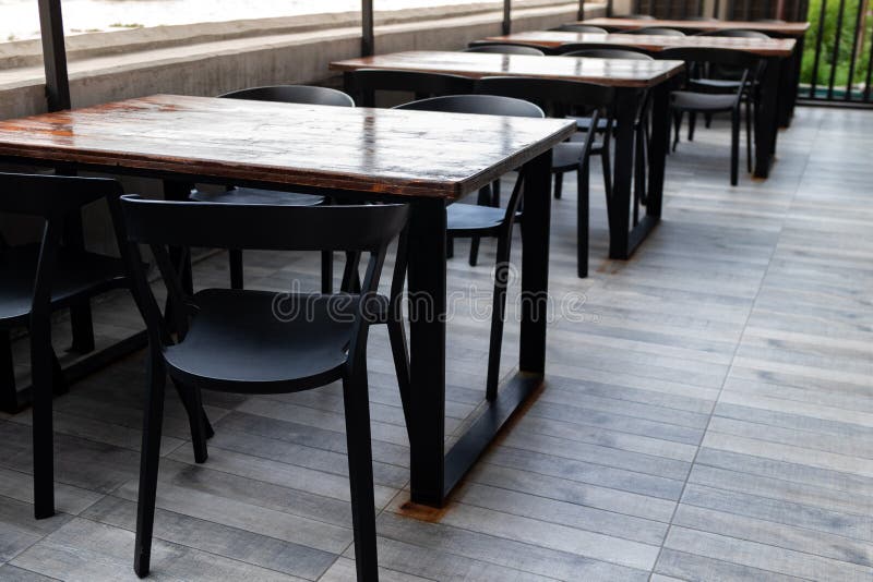 Empty tables and chairs. stock photo. Image of reflection - 211468384