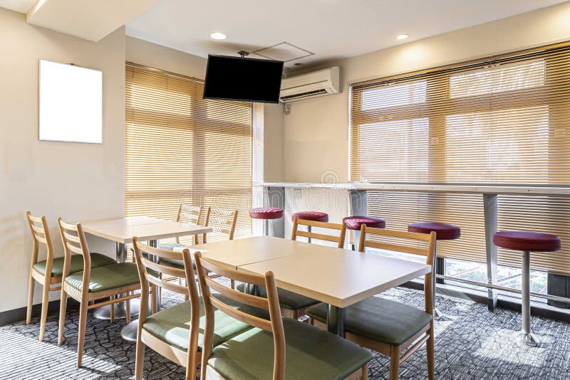 Tables and Chairs Inside a Small Breakfast Room in the Hotel Stock ...