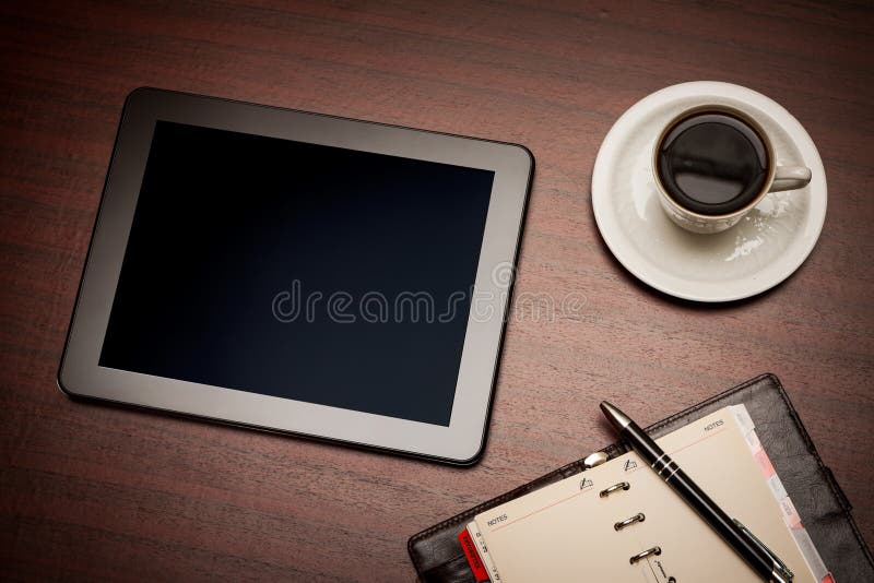Tablet Pc and a Coffee and Notebook with Pen on the Office Desk Stock ...