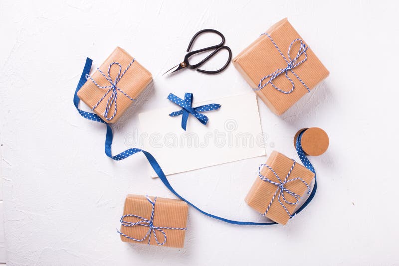 Empty Tag and Wrapped Gift Boxes with Presents on Textured Bac Stock ...