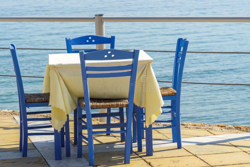 Empty Tavern Restaurant by the Seafront with Wooden Chairs and Tables ...
