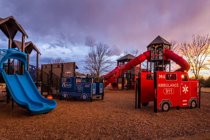 Empty Themed Playground Against the Backdrop of a Sunset during a ...
