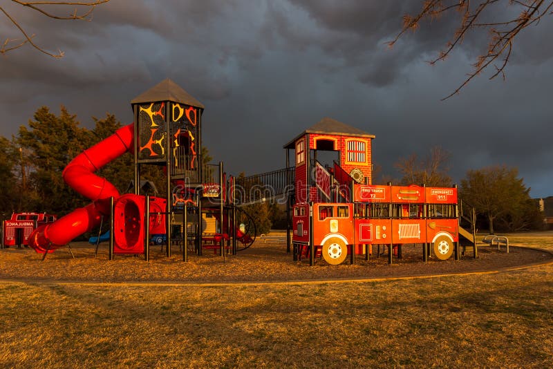Empty Themed Playground Against the Backdrop of a Sunset during a ...