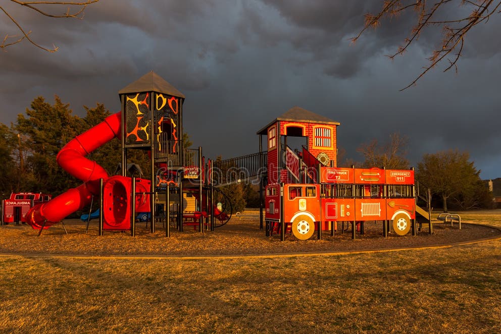 Empty Themed Playground Against the Backdrop of a Sunset during a ...