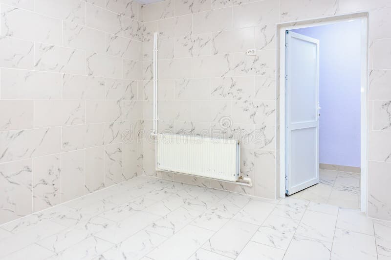 Empty Tiled Room with Open Door and Radiator Stock Image - Image of ...