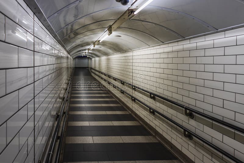 Empty Tunnel in the London Underground with White Tiles and Fluorescent ...