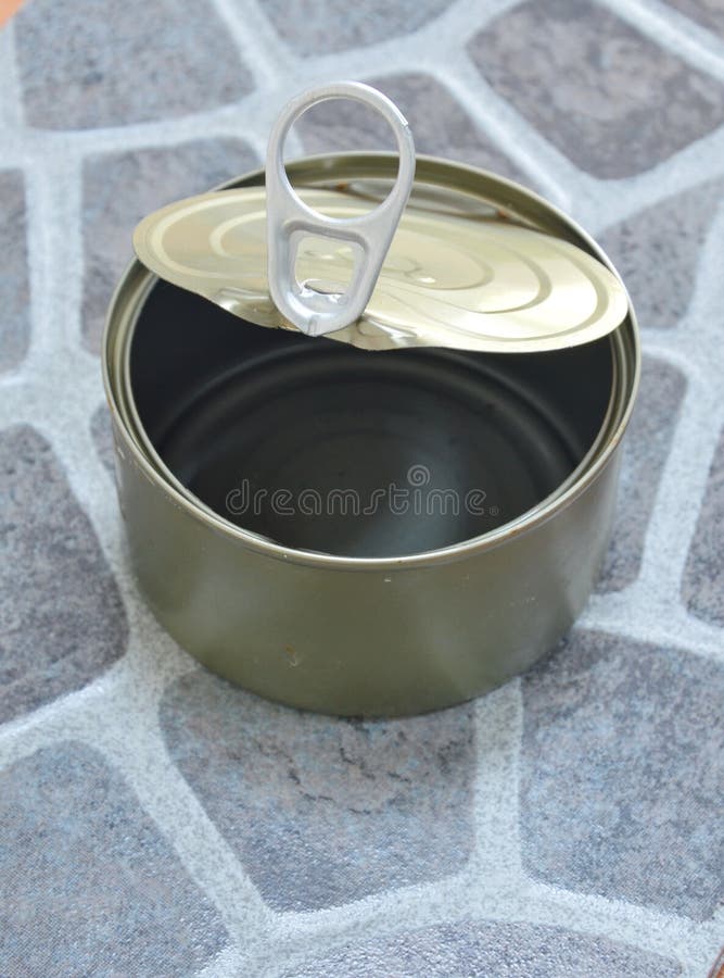 Empty tin can on floor stock photo. Image of board, metal - 59966120