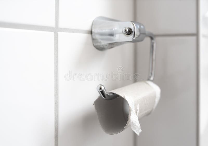 Empty Toilet Paper Roll on Bathroom Tissue Holder Stock Photo - Image ...