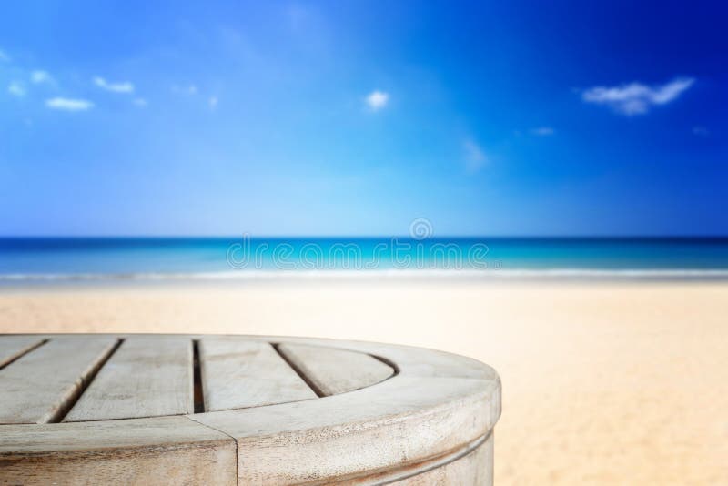 Top Wooden Table and Blur of Tropical Beach Background Stock Photo ...