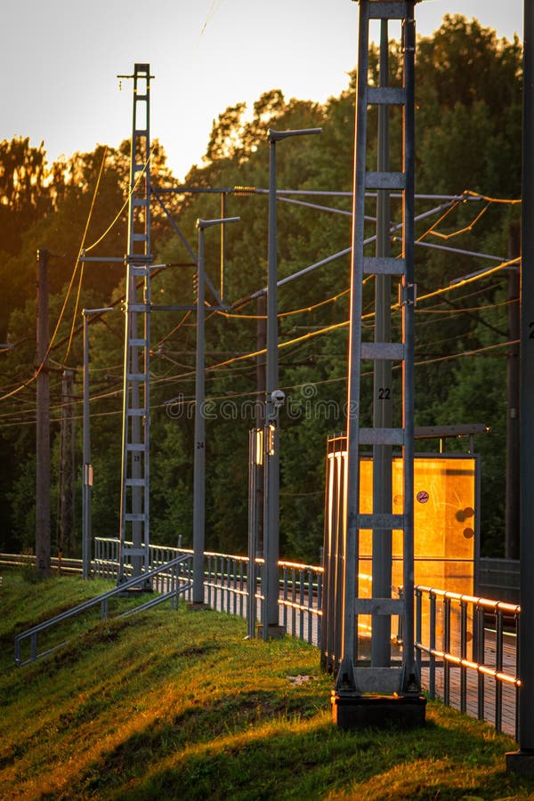 An Empty Train Stop Illuminated by the Golden Sunlight at Sunset in ...