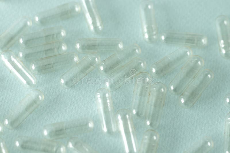 Empty Transparent Pills and Capsules on a Blue Background. Stock Image ...