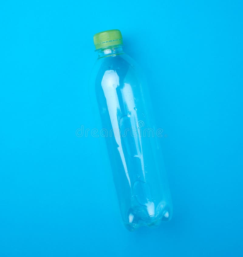 Empty Transparent Plastic Bottle on a Blue Background Stock Image ...