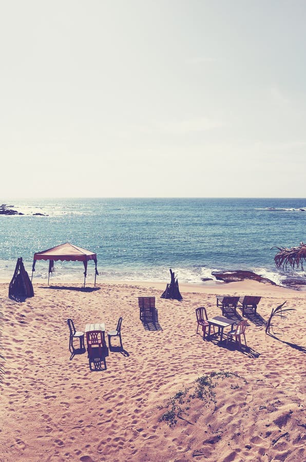 Empty Tropical Beach with Tables and Chairs, Retro Color Toning Applied ...