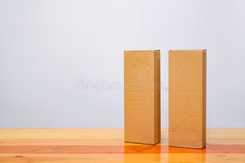 Empty Two Package Brown Cardboard Box for Long Items on Wooden T Stock ...