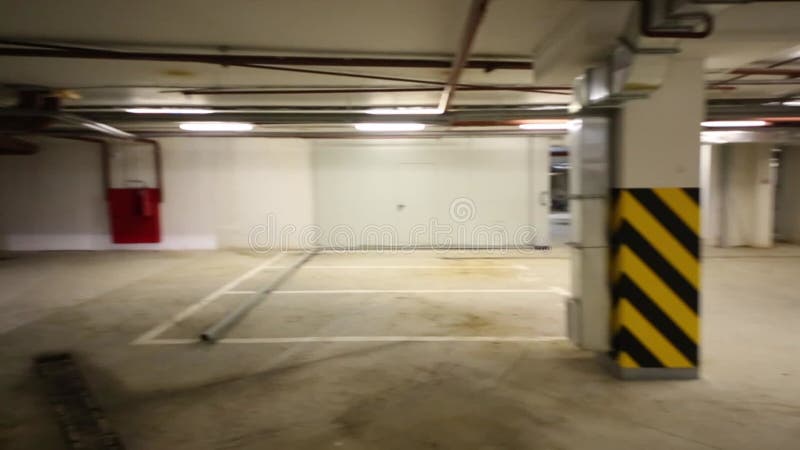 Empty Underground Parking with Columns and Pipes Stock Video - Video of ...