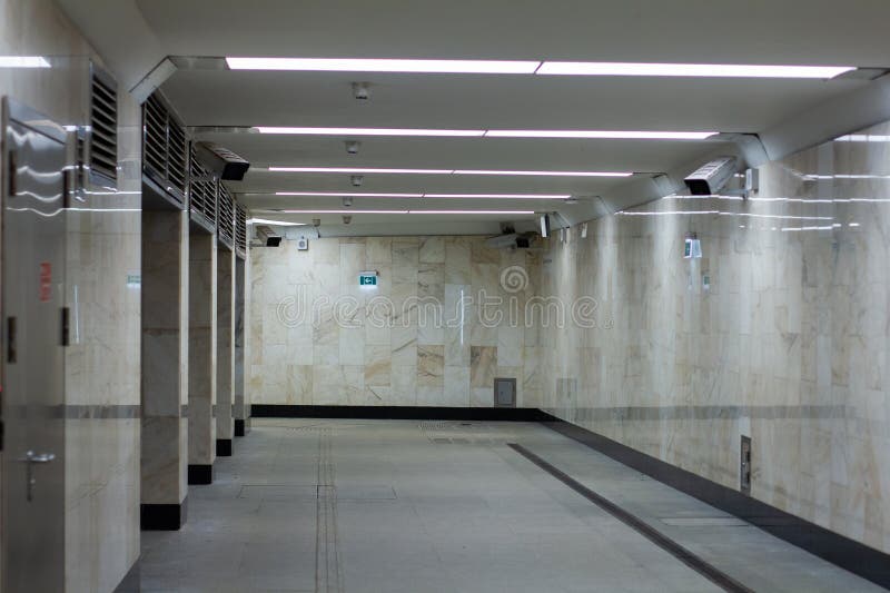 An Empty Underground Passage with Marble Walls, Bright Lighting ...