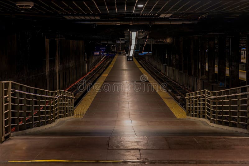 Empty Underground Train Station Platform with Dim Lighting. Stock Photo ...
