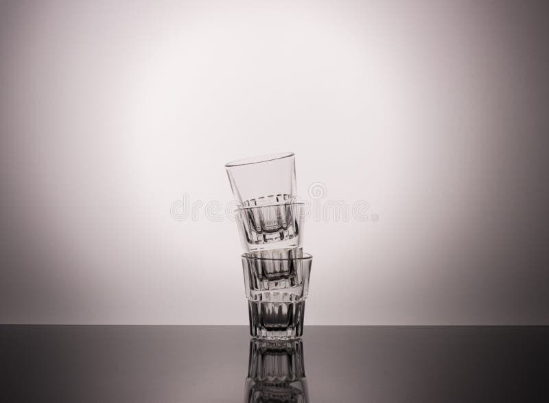 Empty Vodka Glasses are Built Like a Skyscraper with a Beautiful ...