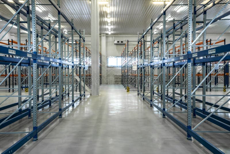 Empty Warehouse Shelves in Grey Industrial Interior Stock Photo - Image ...