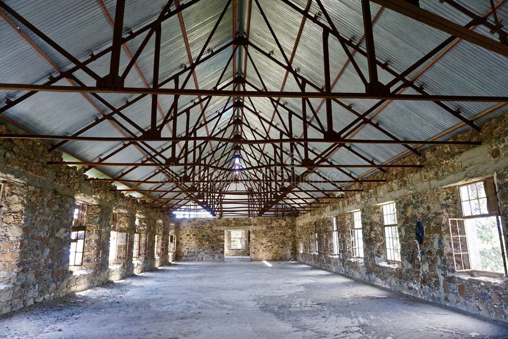 Empty Warehouse with Stone Walls and Steel Ceiling Stock Image - Image ...
