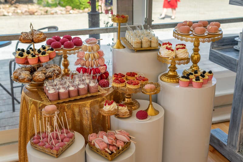 Empty Wedding Reception Dessert Table with Pink and Gold Decorations ...