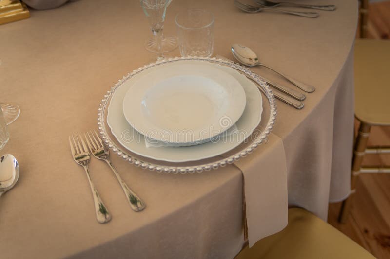 Empty Wedding Reception Hall Table Setting with Silverware and Plates ...