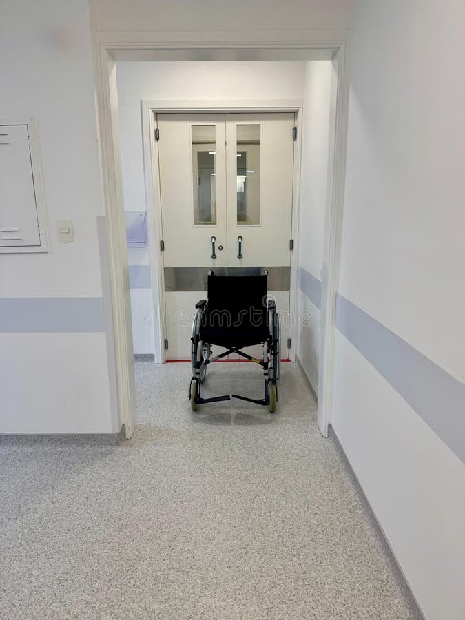 Empty Wheelchair in Hospital Hallway Stock Photo - Image of healthcare ...