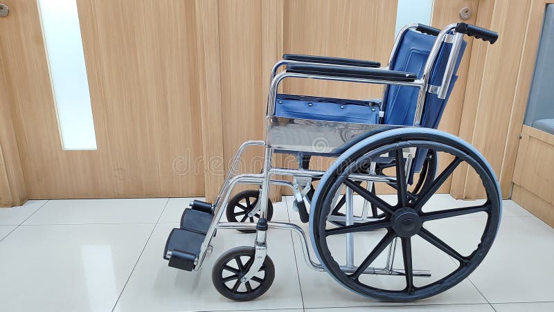 Empty Wheelchair Near Beige Wall Stock Photo - Image of lifestyle ...