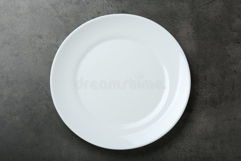 Empty White Ceramic Plate on Grey Table, Top View Stock Photo - Image ...