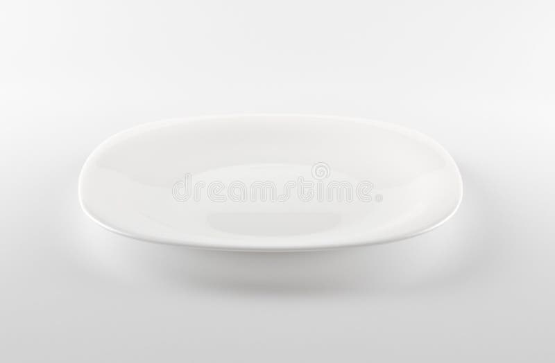 A White Dish Filled with Uncooked Wholewheat Fusilli Pasta Stock Photo ...