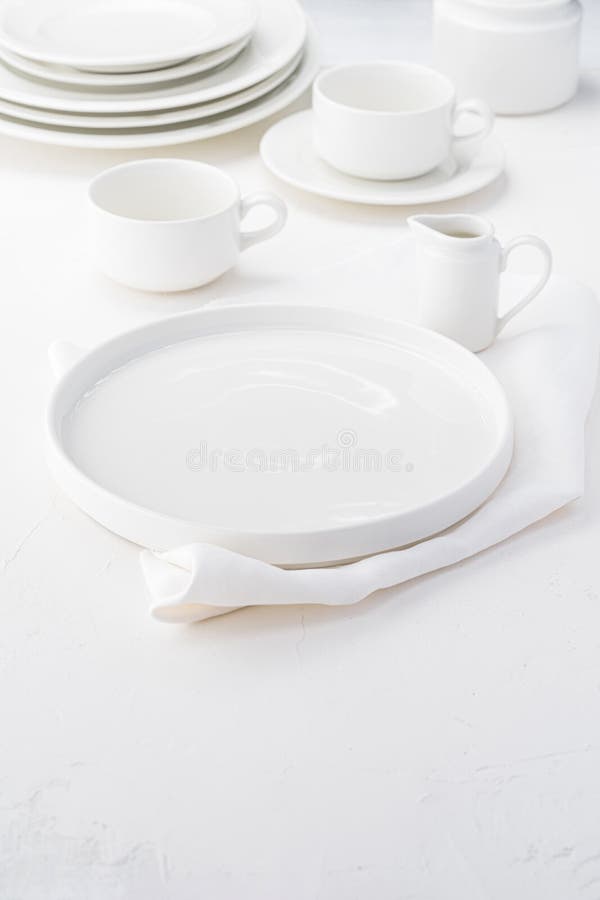 Empty White Dishes on a White Table Stock Photo - Image of fine ...
