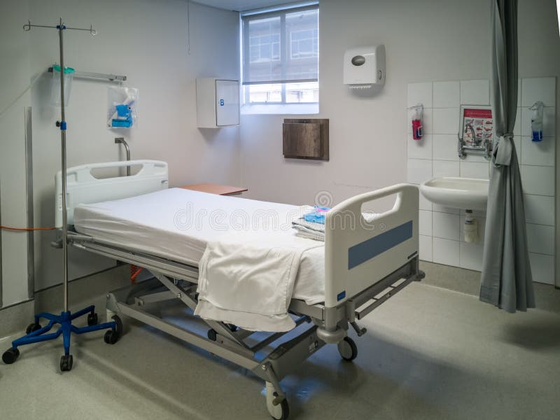 Empty White Hospital Bed in Clean Clinic Stock Image - Image of wheel ...