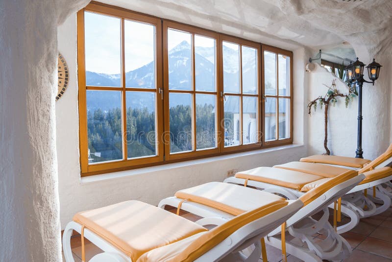 Empty White Lounge Chairs in Front of Windows at Luxury Hotel Stock ...