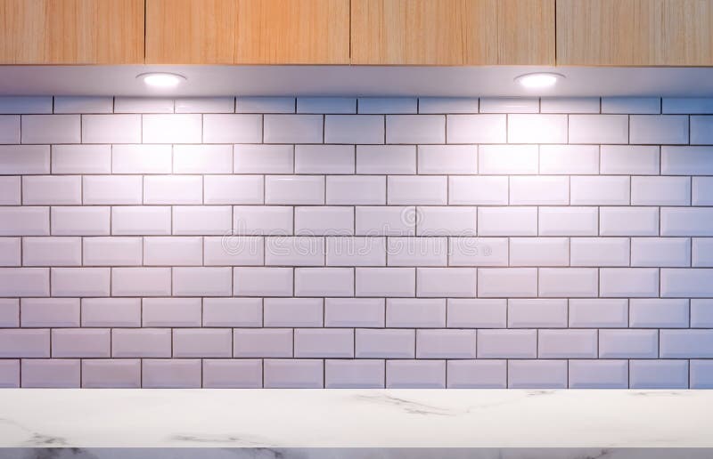 Empty White Marble Counter with Lighting on White Tile Wall and Wooden ...