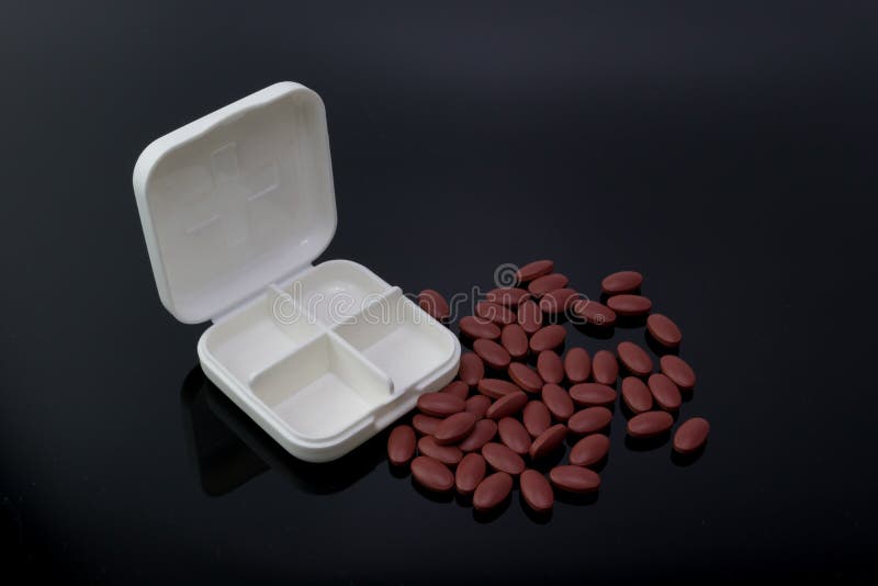 The Empty White Medicine Box with Spread Pills on the Black Reflective ...