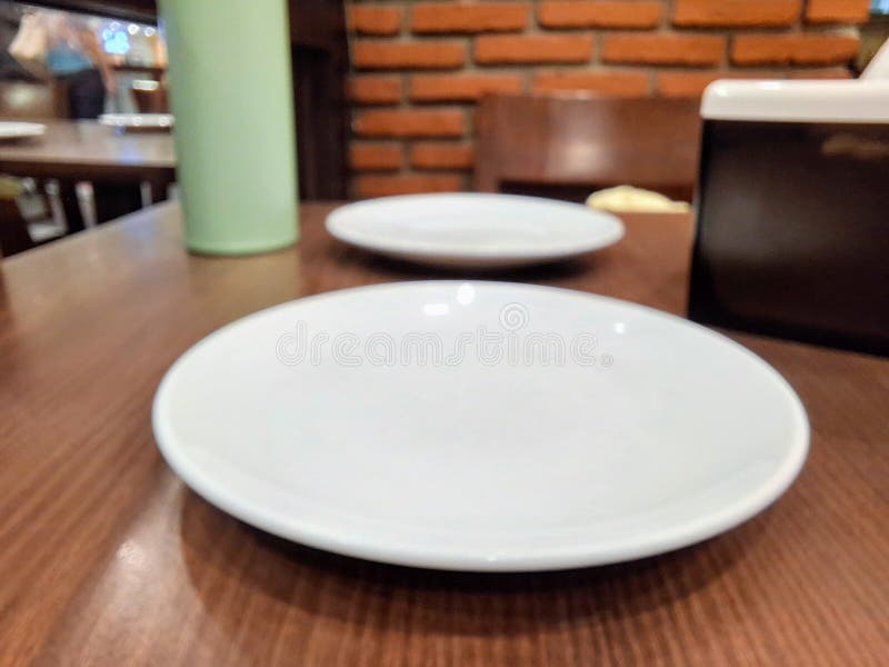 Empty White Plates on a Wooden Table Stock Image - Image of empty ...