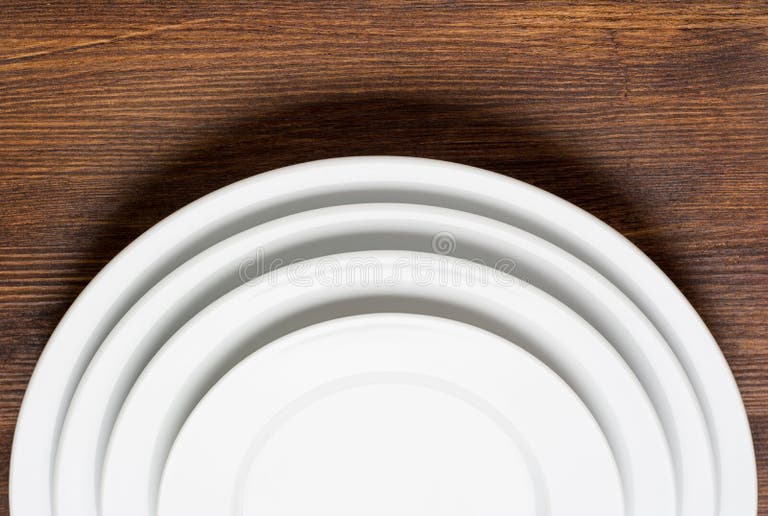 Empty White Plates on Wooden Table Stock Photo - Image of table, wood ...