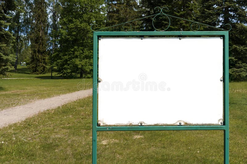 Empty White Sign with Antique Metallic Frame in a Park Stock Image ...