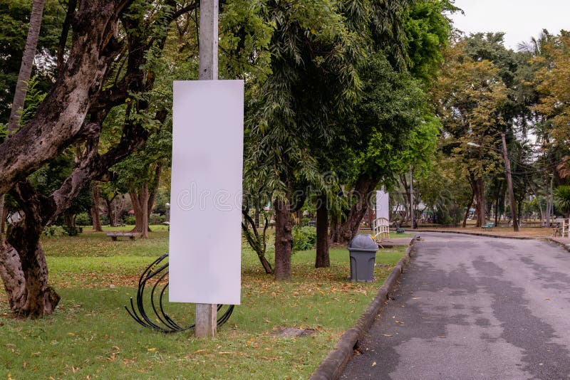 Empty White Sign Next To a Road in a Park Stock Image - Image of ...